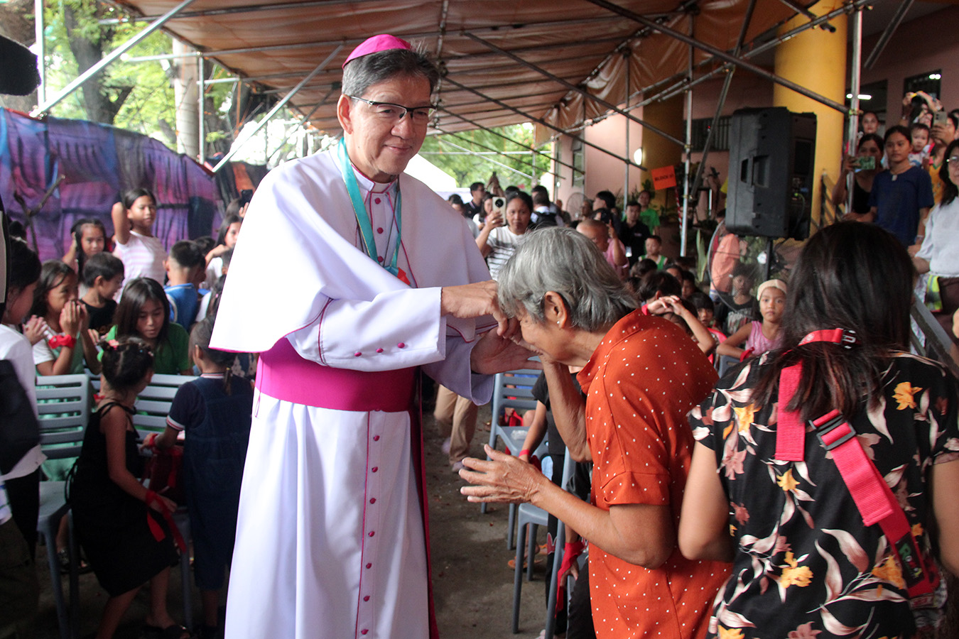 Cebu archbishop plants trees, shares meal with poor ahead of ...